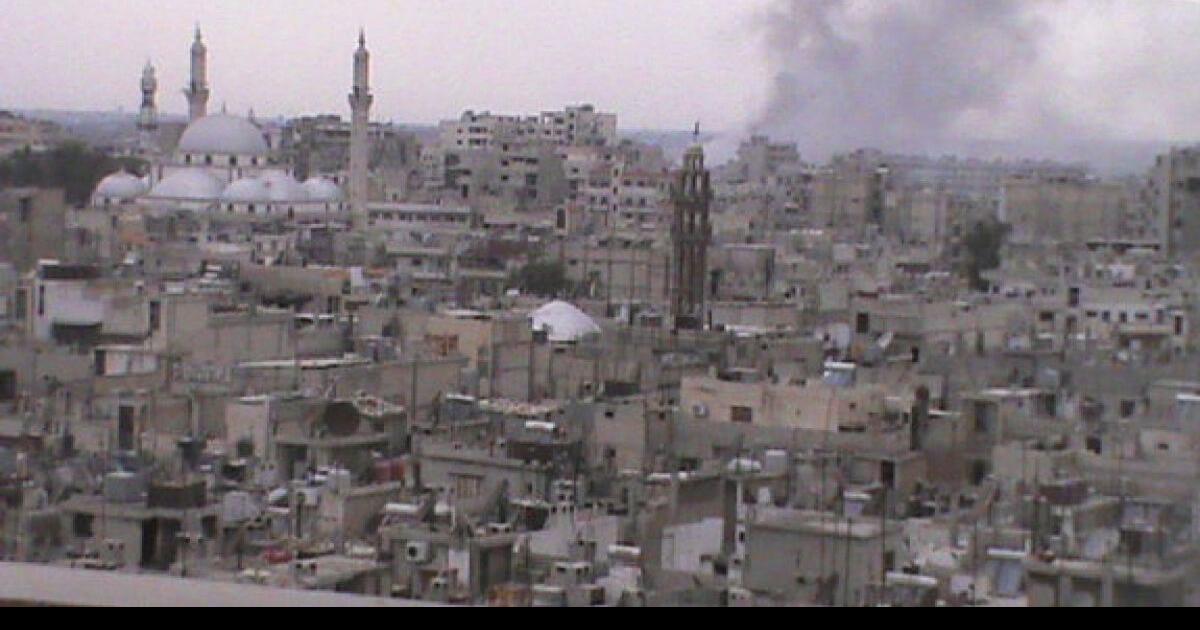 Rebels back off as Syrian forces advance into Homs