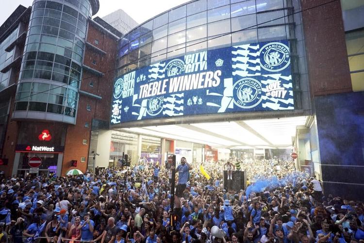 Manchester City celebrates winning treble of major trophies with open ...