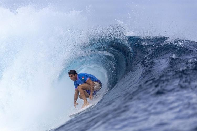 Olympics surfing competition starts in Tahiti with wave rides, wipe outs