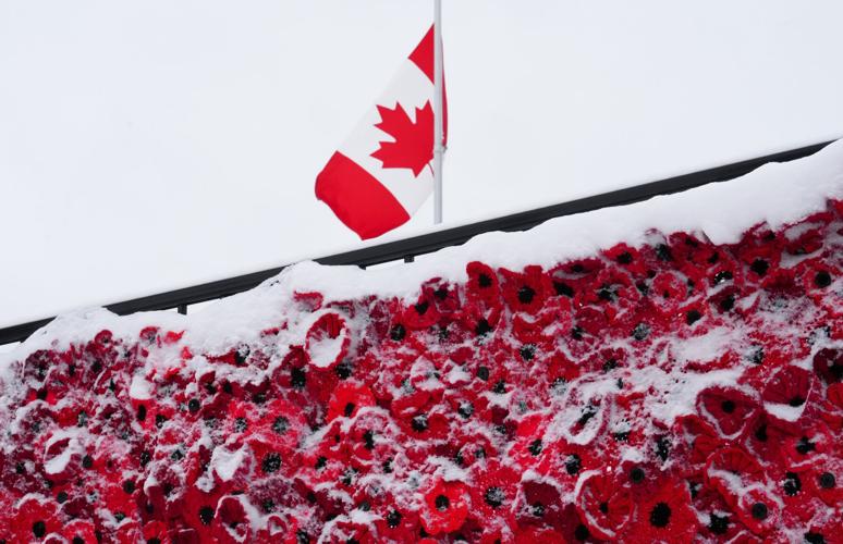 The Latest: Canadians honour those who lived and died in the country's ...