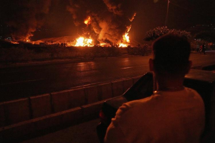 AP photos show dramatic explosions, protests and floods