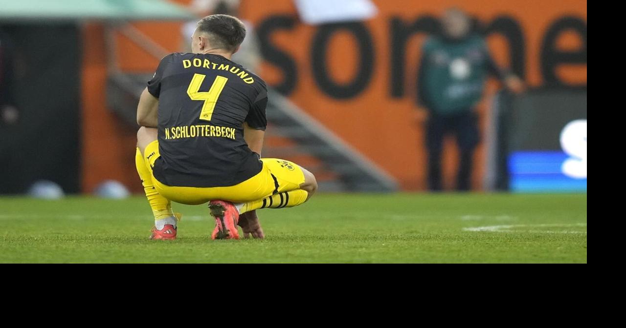 Dortmund slumps to another loss at Augsburg as Leipzig tops the Bundesliga
