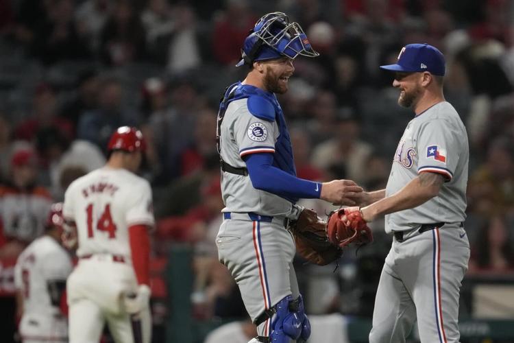 Rangers score four runs in ninth to beat Angels 9-8