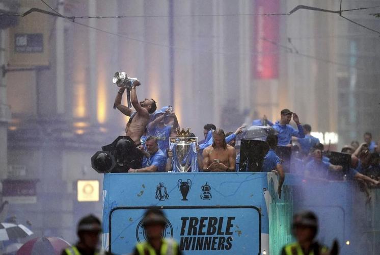 Manchester City celebrates winning treble of major trophies with open ...
