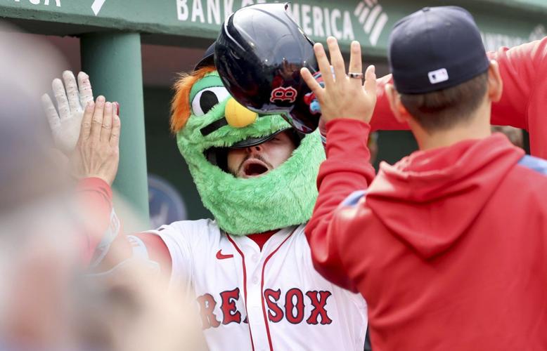 Off the wall: Red Sox celebrate home runs by wearing the head of mascot ...