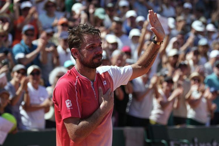 Wawrinka waves emotional goodbye to French Open after losing in first round