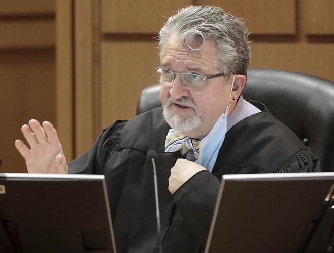 Trial starts for Wisconsin man accused of killing parents