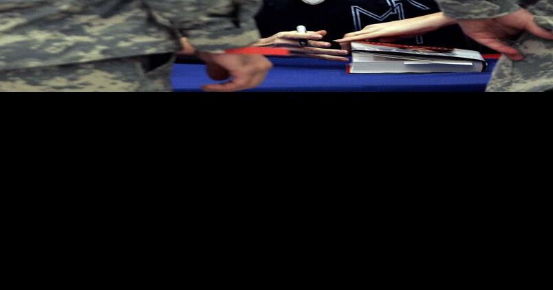 Sarah Palin marches book campaign to army base