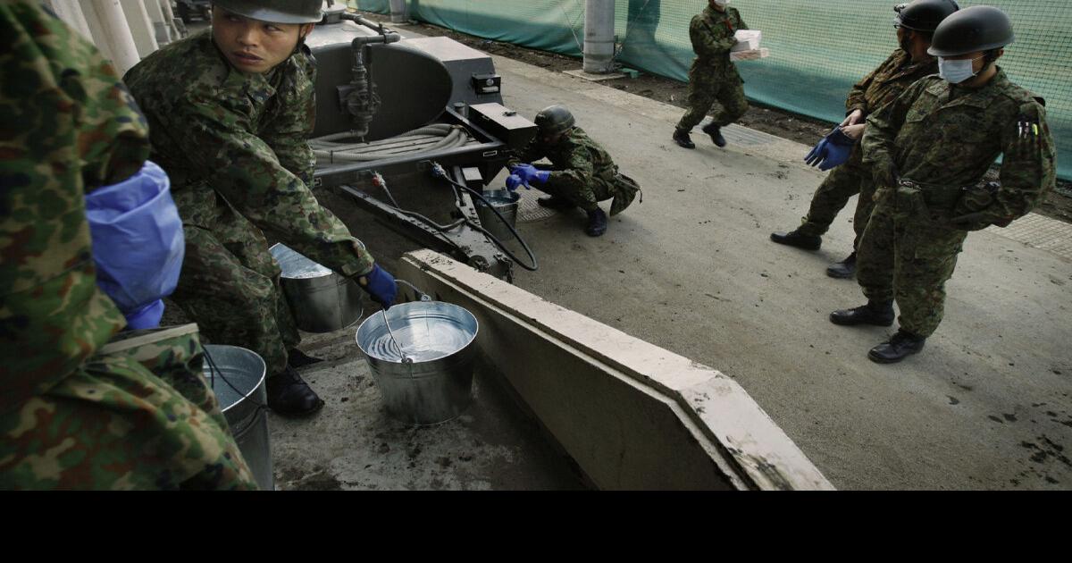 Japan mobilizes 100,000 troops for tsunami recovery