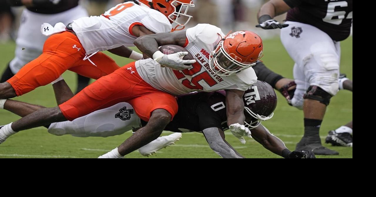 King throws 3 TDs as No. 6 Texas A&M downs Sam Houston 31-0