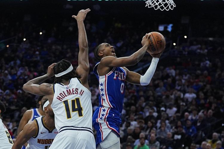 Brown's goaltended layup in OT lifts short-handed Nuggets over 76ers ...