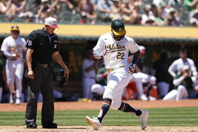 Butler homers, Sears pitches A's to series sweep of Angels with 5-0 win