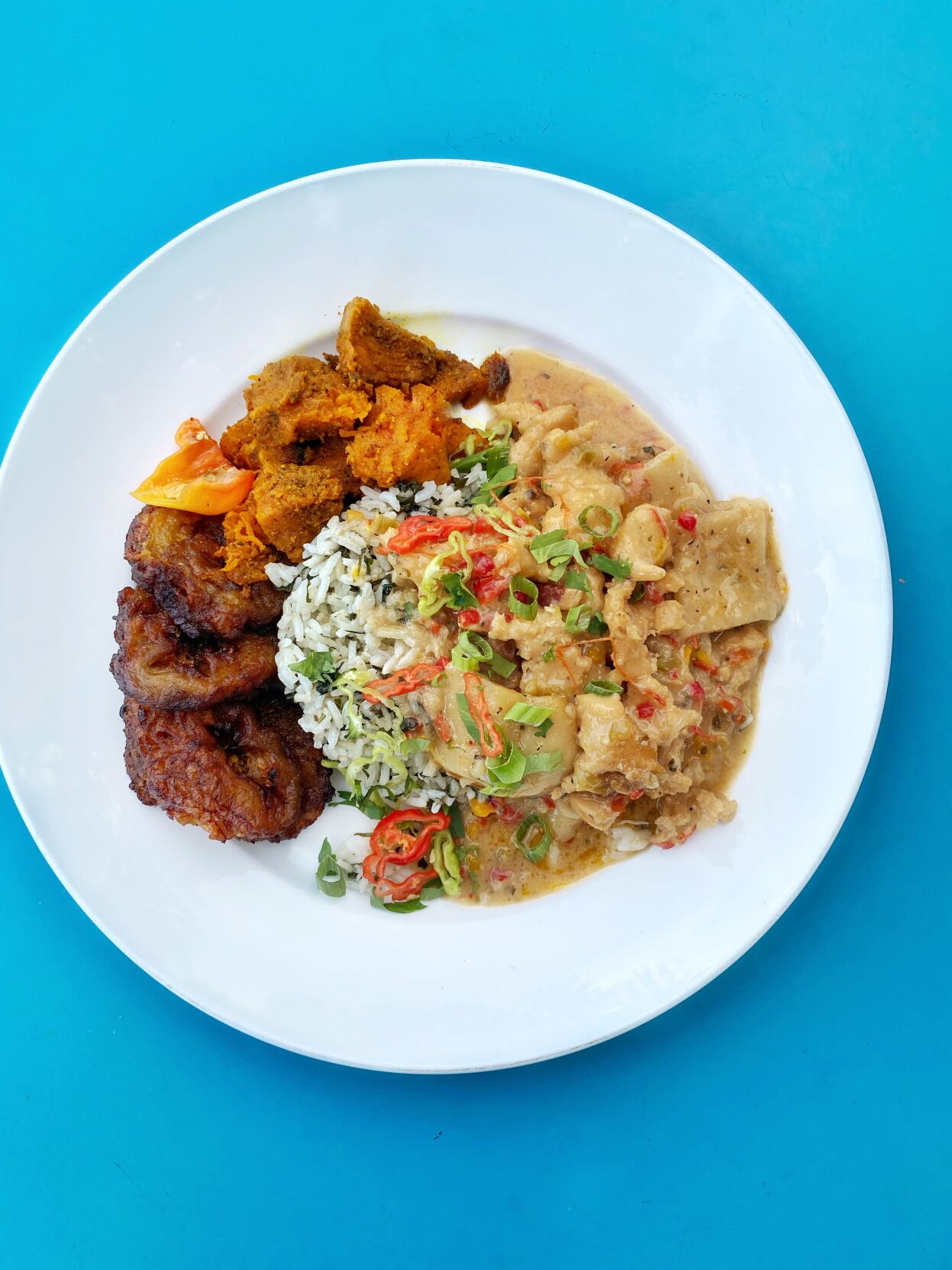 Stewed Conch with Callaloo Rice and Roast Pumpkin