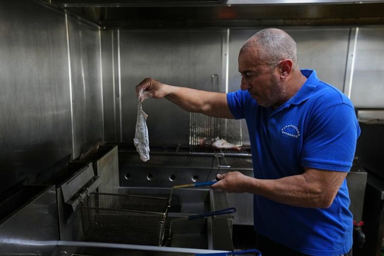 Cypriot fishermen battle invasive lionfish and turn them into a tavern ...