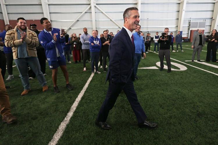 New coach John Harbaugh embraces the challenge of turning the Giants ...