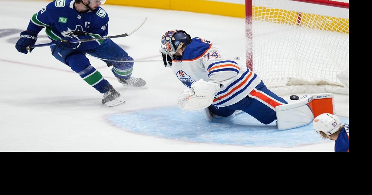 Hughes helps Canucks power past Oilers 5-2