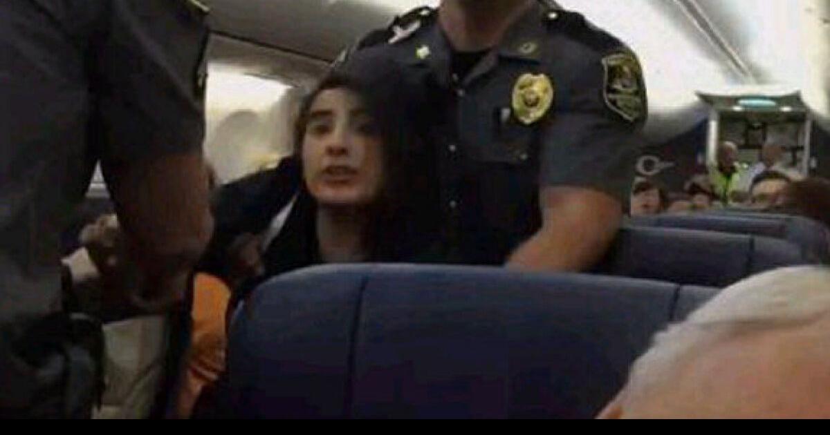 Police drag woman off Southwest Airlines flight