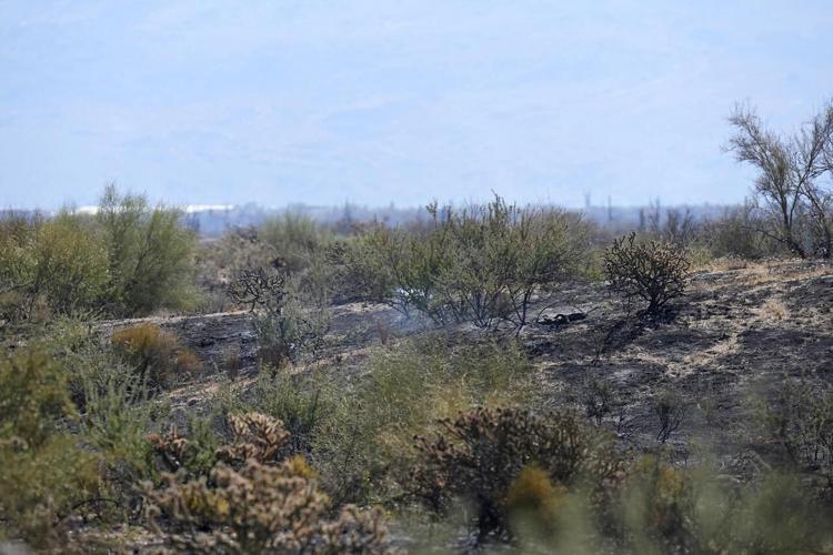 Over 1,000 people remain evacuated as crews dig containment line around ...