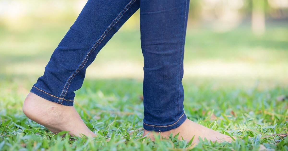 Grounding — walking on grass barefoot — has health benefits, research says