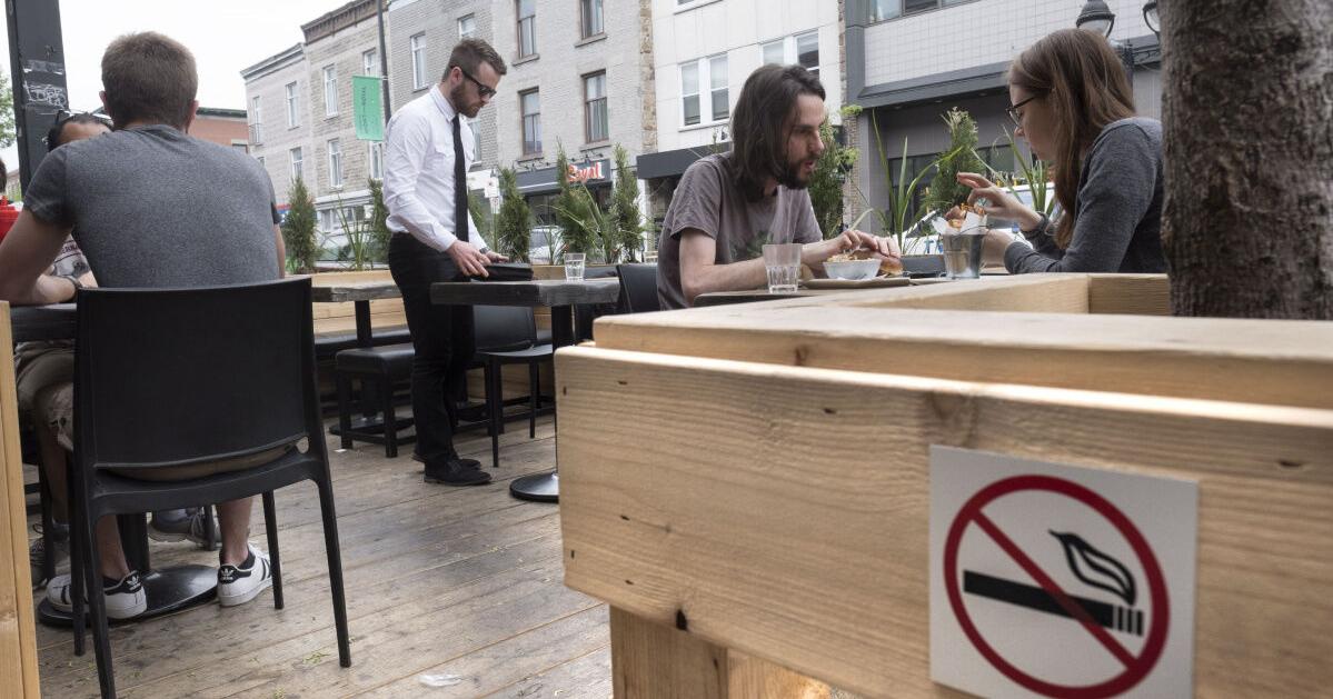 Quebec smokers will soon have to butt out on patios