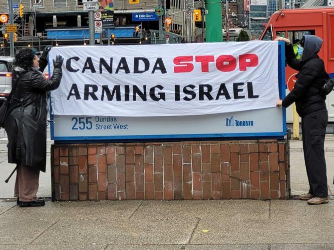 Protesters gather at Toronto police station