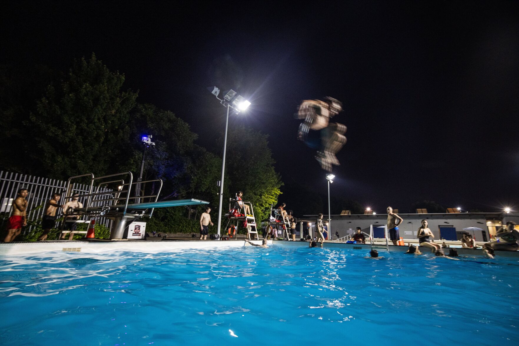 Night swimmers beat the heat at select Toronto pools