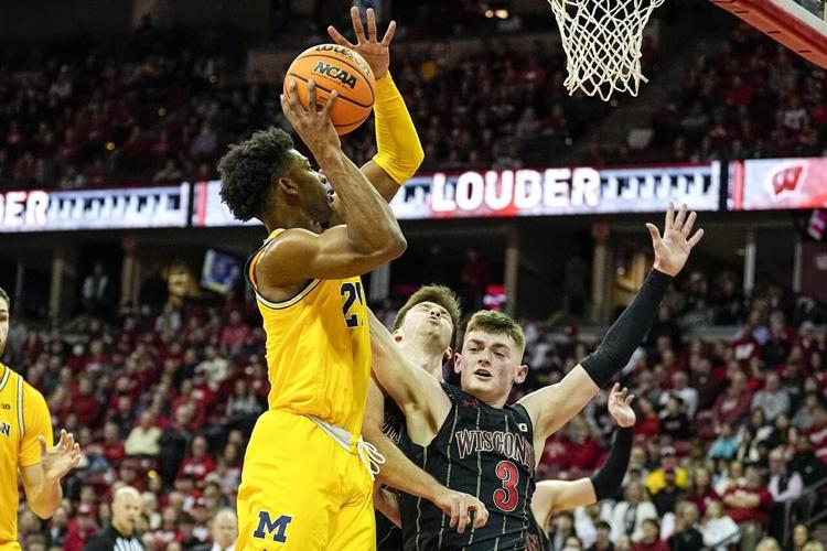 Essegian scores 23, Wisconsin holds off Michigan 64-59