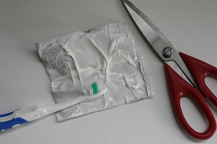 putting toothpaste on a cut