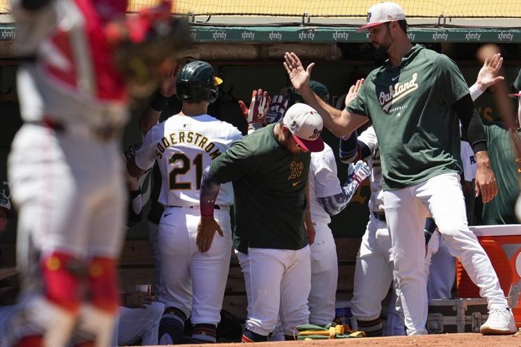 Butler homers, Sears pitches A's to series sweep of Angels with 5-0 win
