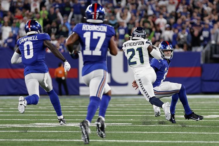 Rookie Devon Witherspoon scores on 97-yard pick-6 as Seahawks' defense ...