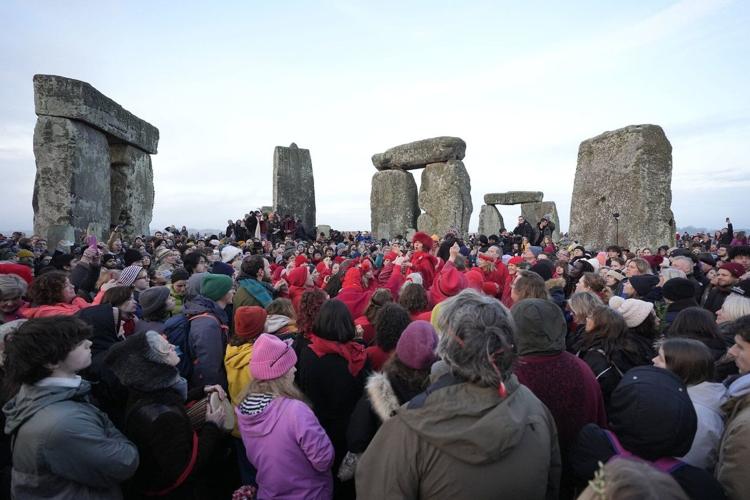 Thousands cheer as the sun rises on winter solstice at Stonehenge