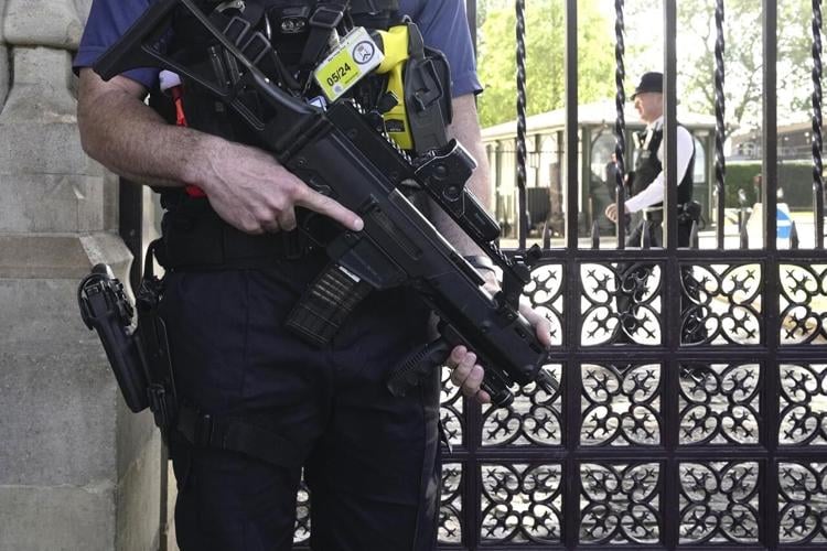 London police call for backup as armed officers lay down guns after ...