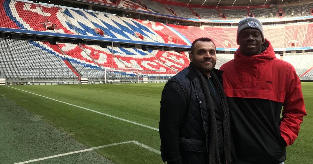 Family friend Nick Huoseh helping guide Canada teenager Alphonso Davies ...