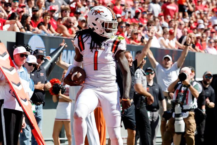 Bailey throws for four TDs as N.C. State rolls past Campbell 56-10