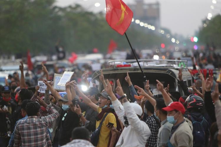 Myanmar junta imposes curfew, meeting bans as protests swell