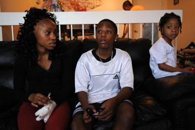 Teen ran into burning home three times