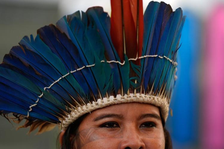 Photos show Indigenous participants at the People's Summit held ...