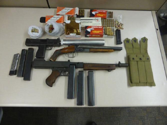 Man, woman charged after Toronto police seize weapons