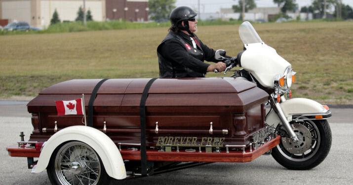 Probert’s casket carried on special motorcycle hearse