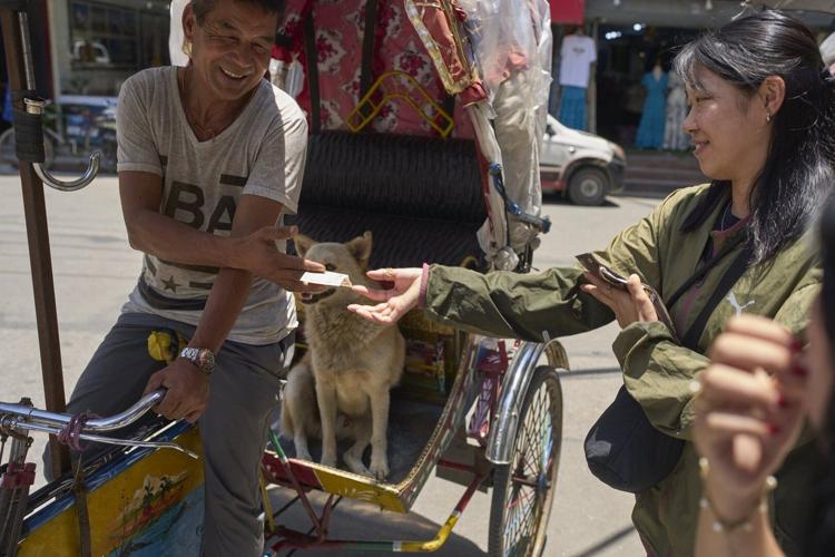 PHOTO ESSAY: A rickshaw driver and his dog are winning hearts in Nepal ...