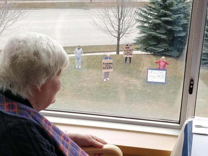Through the nursing home glass, here’s how residents visit with family ...