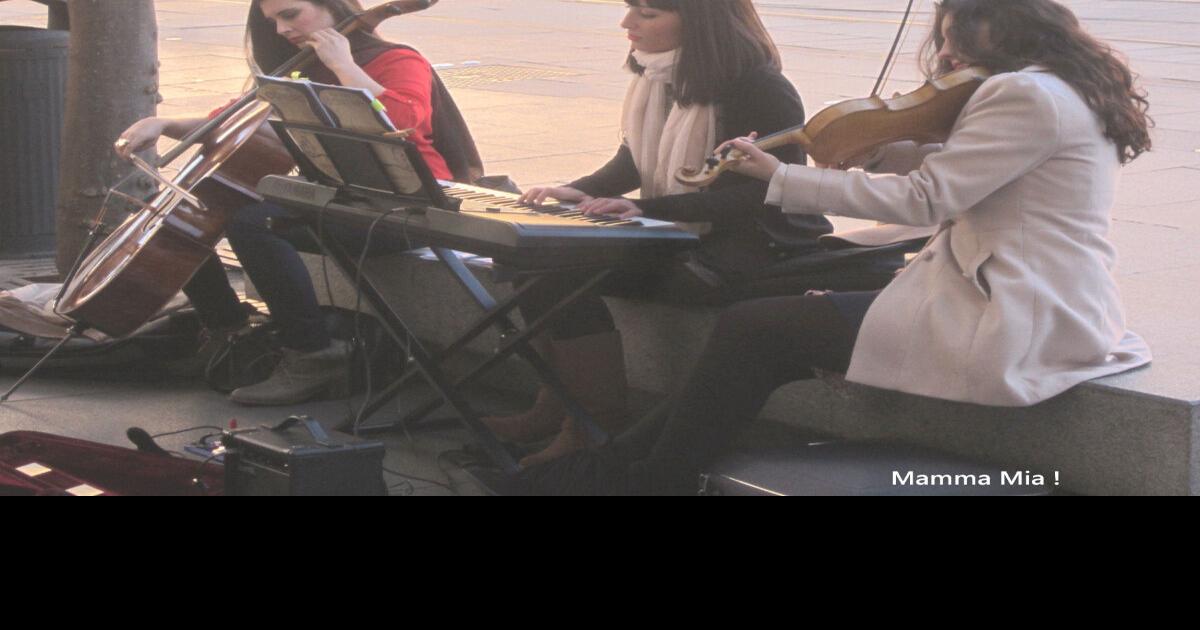 Our readers share their photo of a trio making music in Seville
