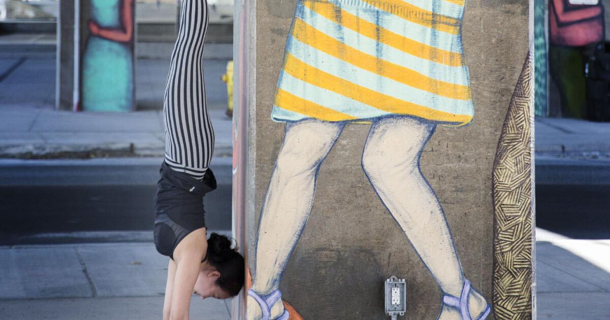 Practise balancing on your head to improve your handstands: Yoga Moves