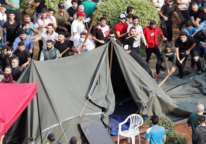 Lebanese block roads as mass demonstrations enter 10th day