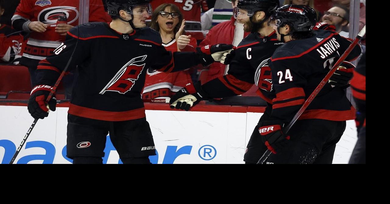 Devils fall to Hurricanes after coach Lindy Ruff hit in the face by a ...
