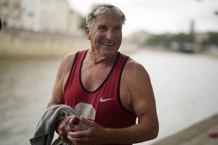 An American swims in Paris' Seine River before the Olympics despite ...