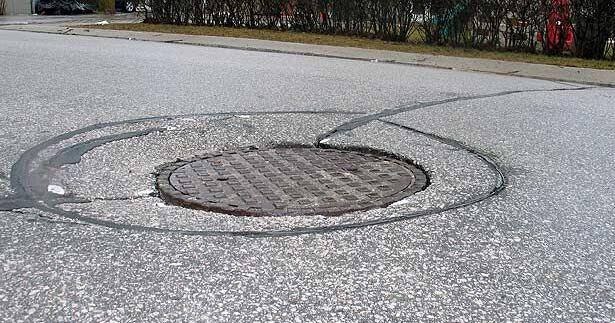 Blowing the lid off manhole covers