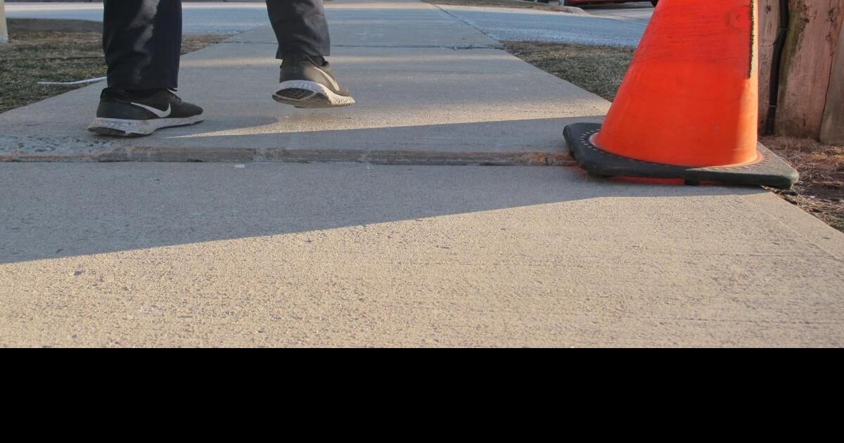 Raised section of sidewalk is a major stumbling block for pedestrians