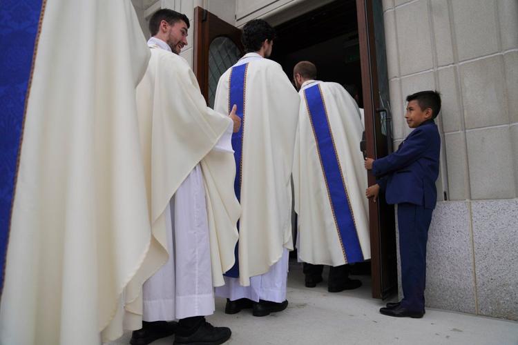 Photos of 12 men who became Catholic priests in the US