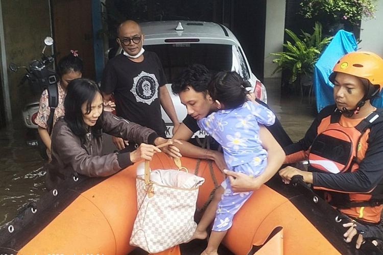 Flash floods in Indonesia leave at least 15 dead and 10 missing